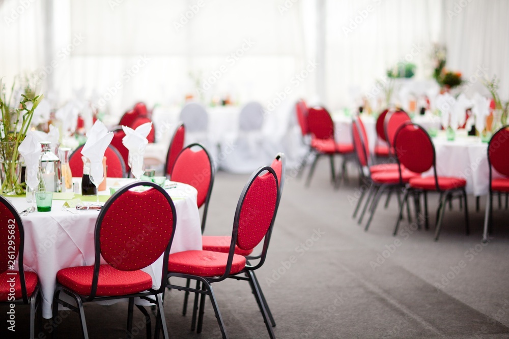 Simple catering in tent reception, red chairs, white background. Stock ...