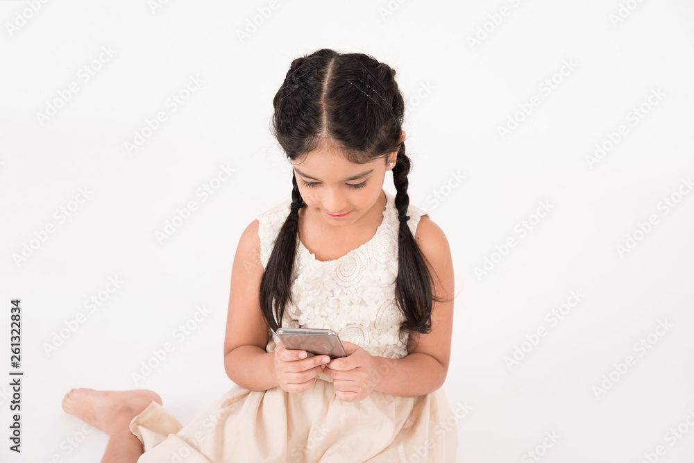 Female child using smart phone Stock Photo | Adobe Stock