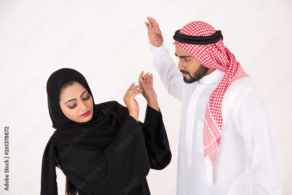 Arab Couple in traditional dress fighting on white background Stock ...