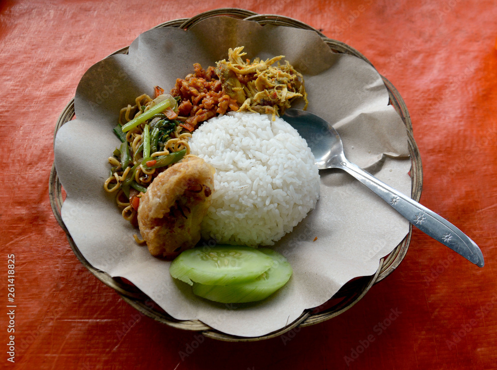Nasi Campur Bali. Balinese dish of steamed rice with variety of side ...