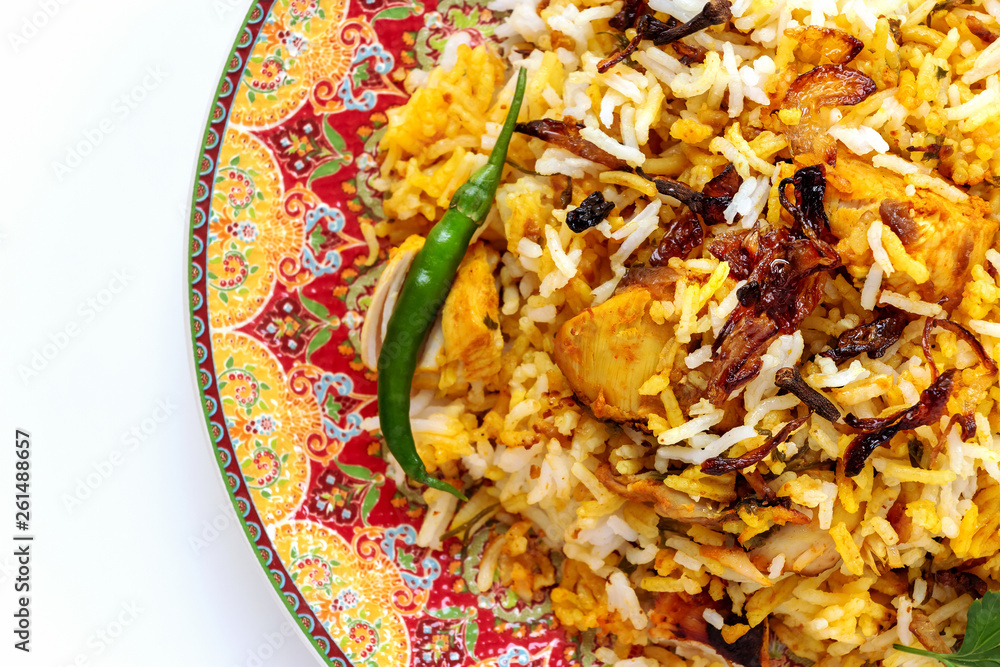 Halal Indian chicken Biryani served with yogurt tomato raita over white ...