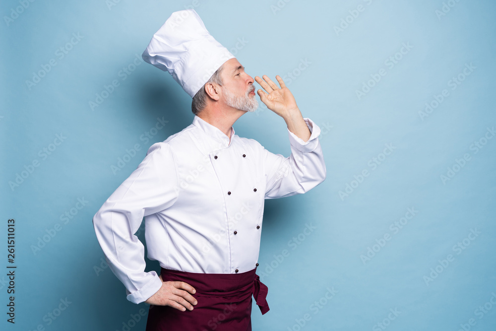 Chef, cook making tasty delicious gesture by kissing fingers. Confident ...