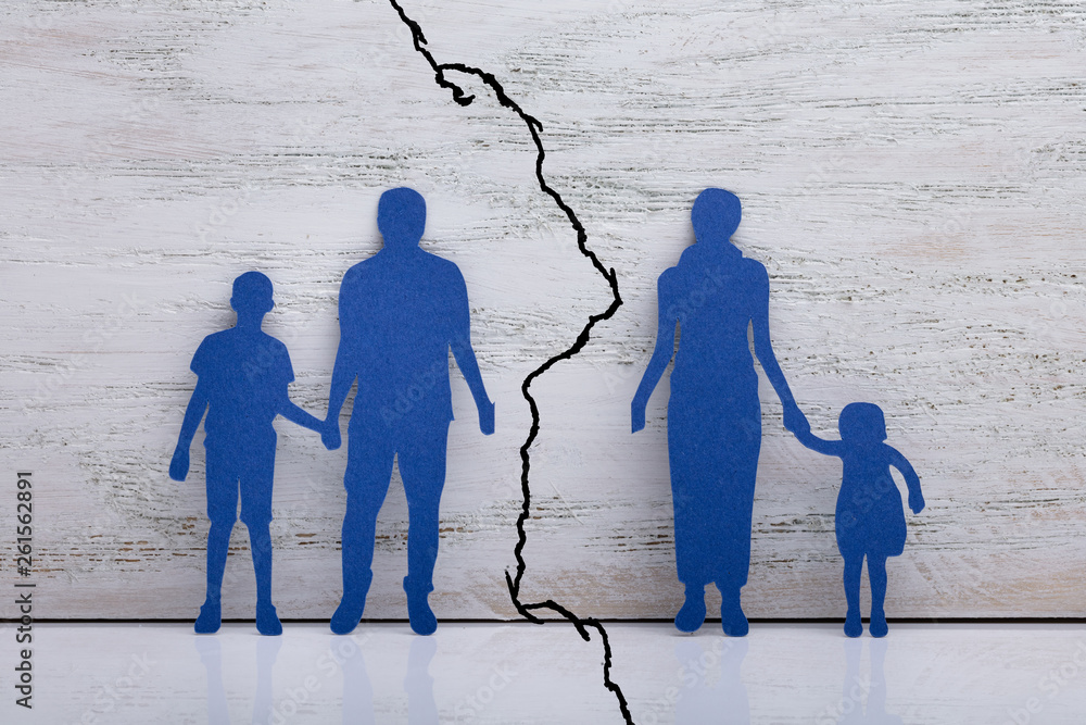Separation Of Family Cutout On Cracked Surface Stock Photo | Adobe Stock