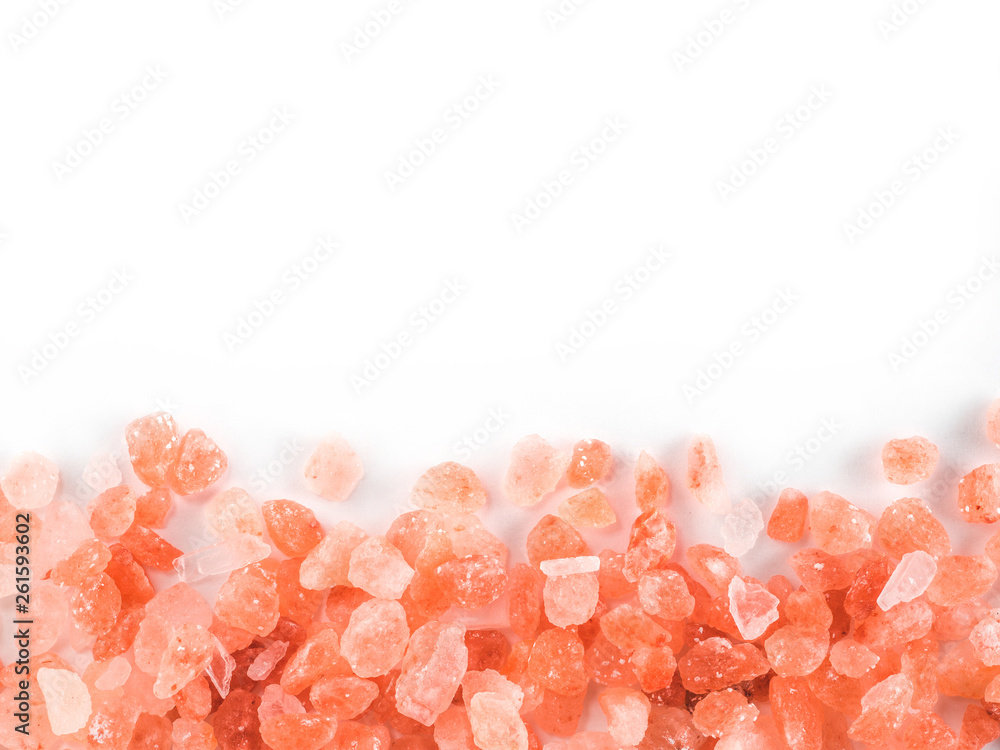 Himalayan pink salt in crystals on white background. Copy space ...