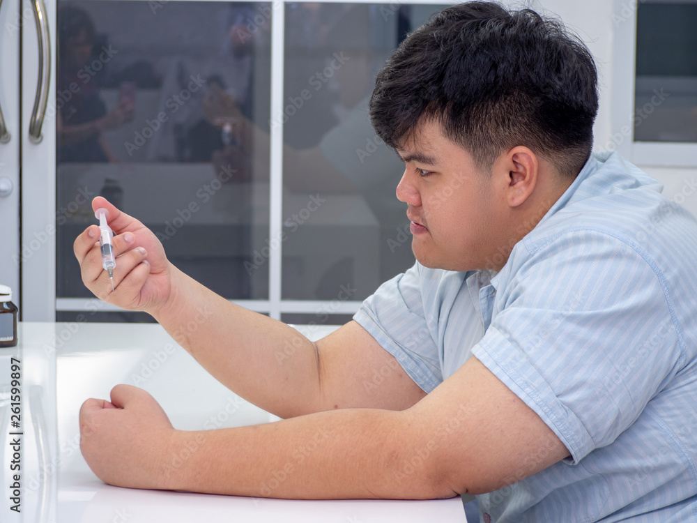 Fat man and his diabetes Stock Photo | Adobe Stock