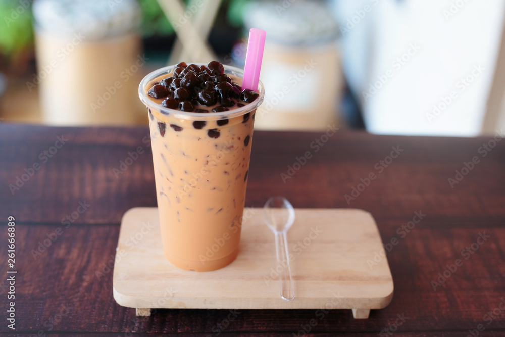 Ice bubble milk tea in takeaway glass. Stock Photo | Adobe Stock