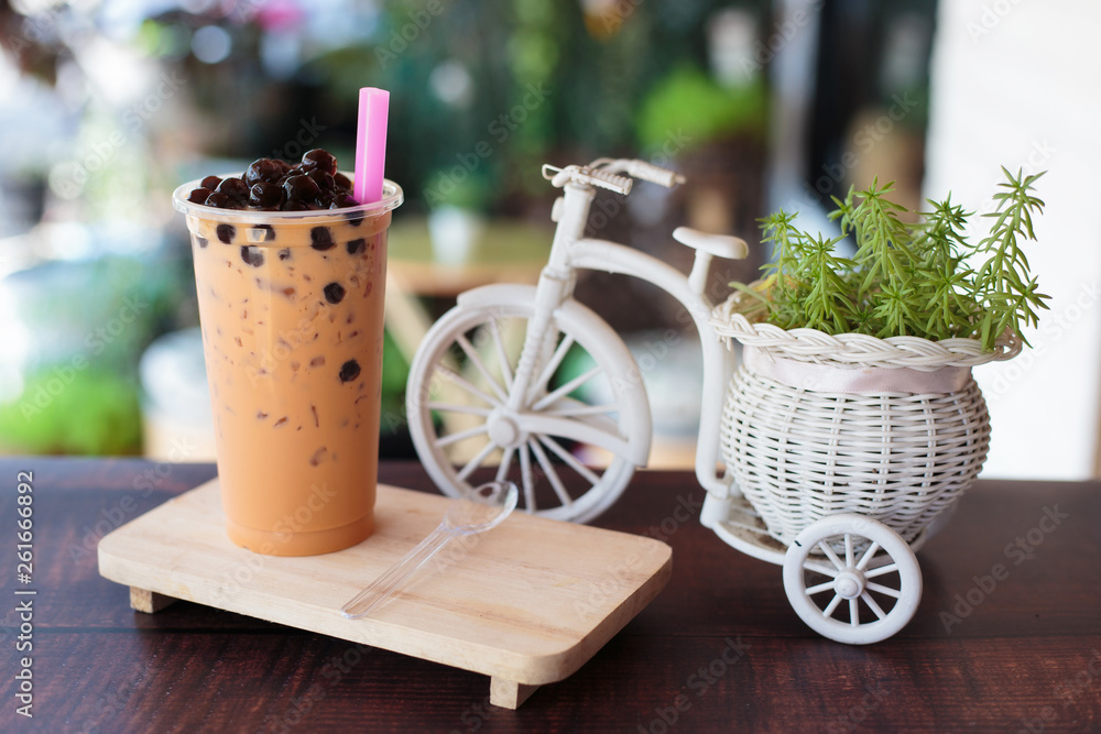 Ice bubble milk tea in takeaway glass. Stock Photo | Adobe Stock
