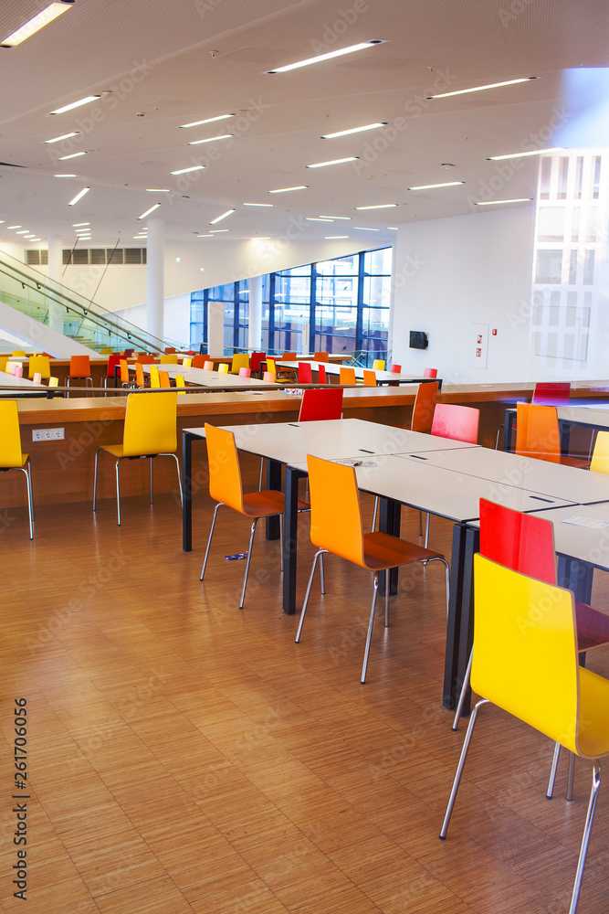 Tables with chairs stand in the classroom Stock Photo | Adobe Stock