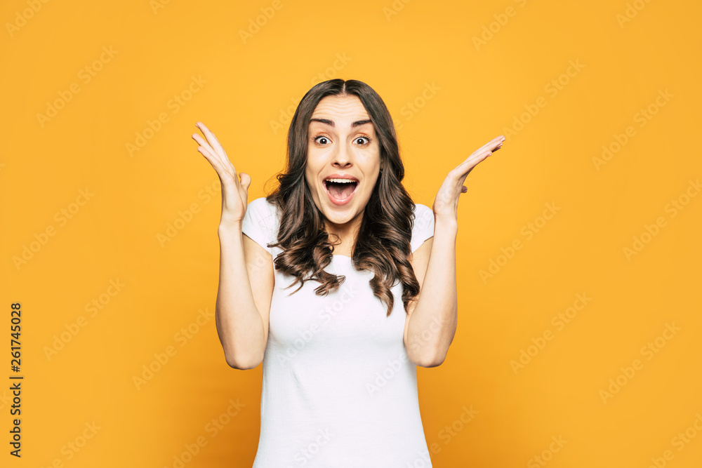 Heyday! Surprised girl with long dark hair and stunning smile full of ...