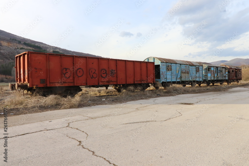 Abandoned old railway wagons at station, old train wagons in an ...