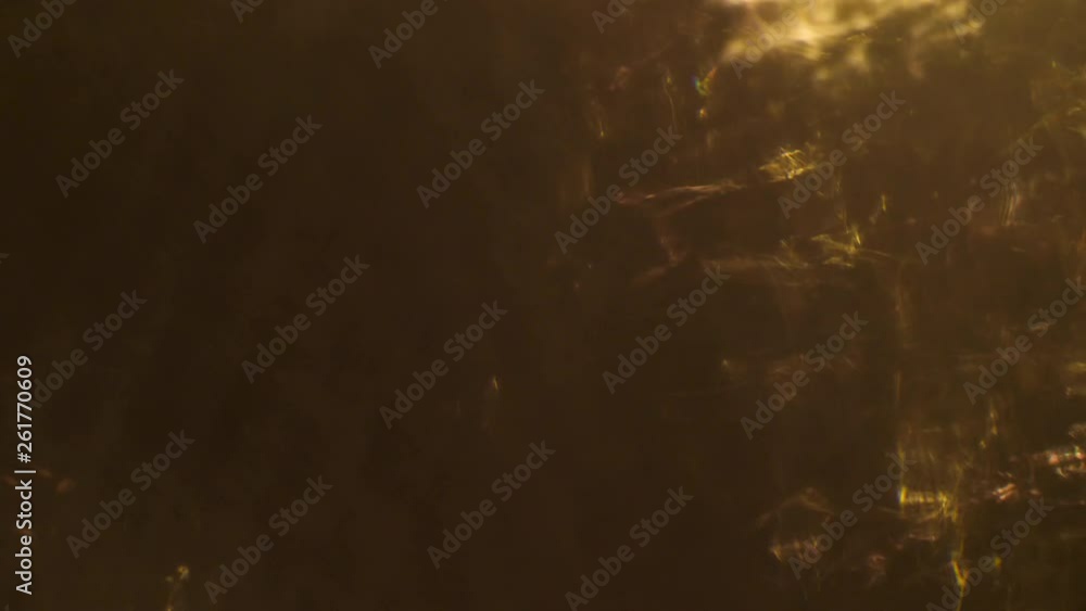 Beautiful abstract effect of warm light shapes. Golden lights in motion ...