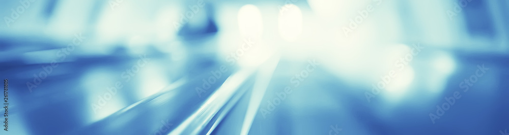 blurred background metro escalator / light blue background movement ...