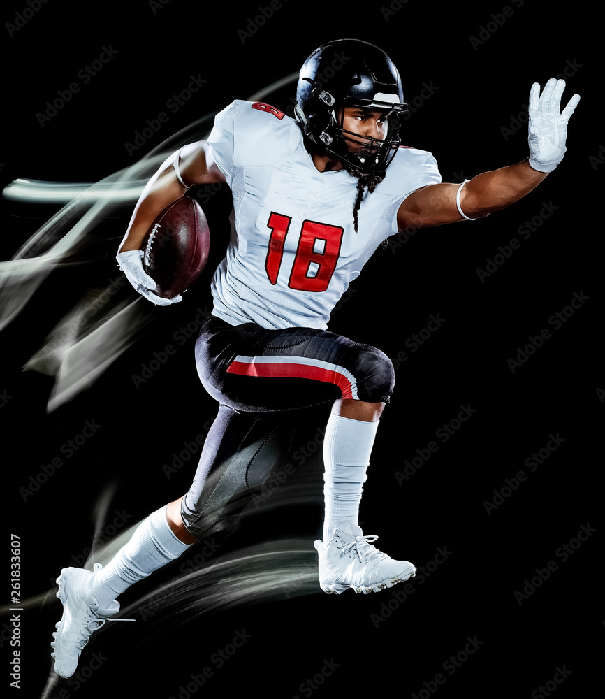 one african american football player man studio shot isolated on black ...