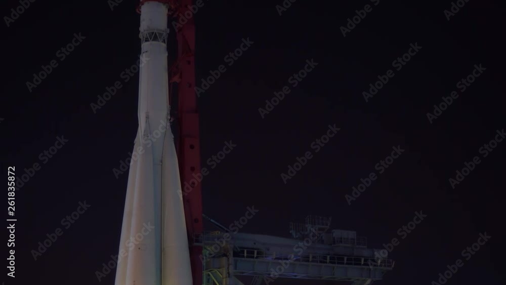 A rocket ready to fly into space on the launch pad. Night. The frame ...