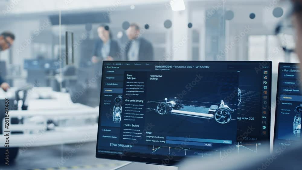 Automotive Design Engineers Talking while Working on Electric Car ...