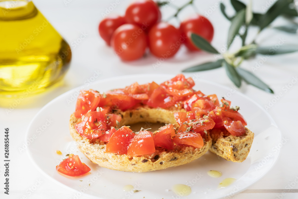 Tipical summer dish of Puglia - friselle. Classical frisella with ...