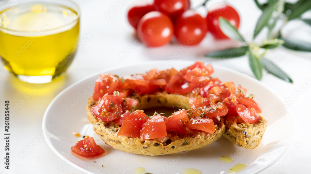 Tipical summer dish of Puglia - friselle. Classical frisella with ...