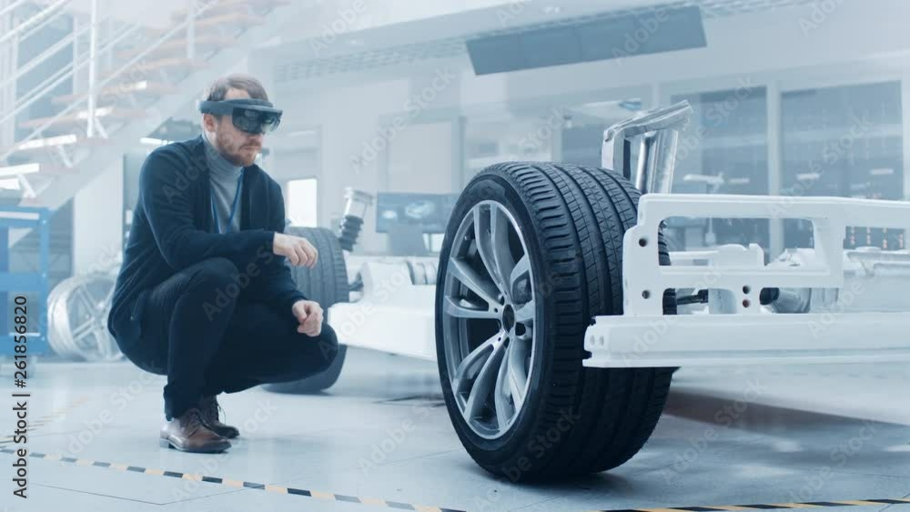 Automotive Engineer Working on Electric Car Chassis Platform, Using ...