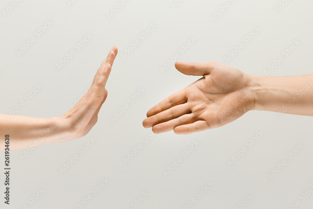 Leave the aggression with you. Two male hands showing sign of greetings ...