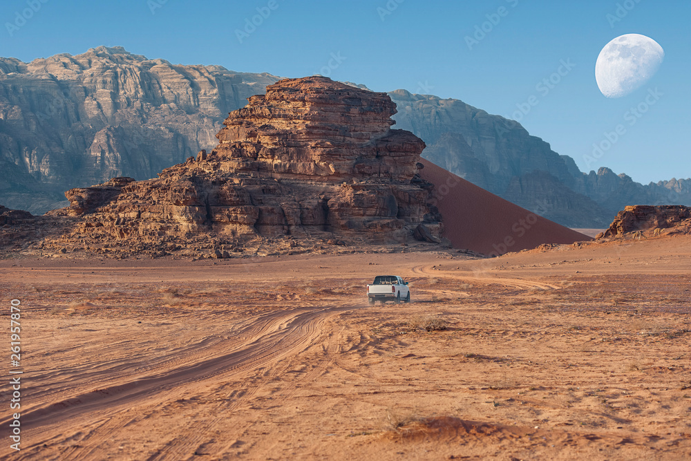 off-road jeep going through incredible lunar landscape in Wadi Rum ...