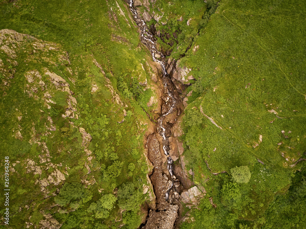 Creek with waterfall in the mountains from above Stock Photo | Adobe Stock