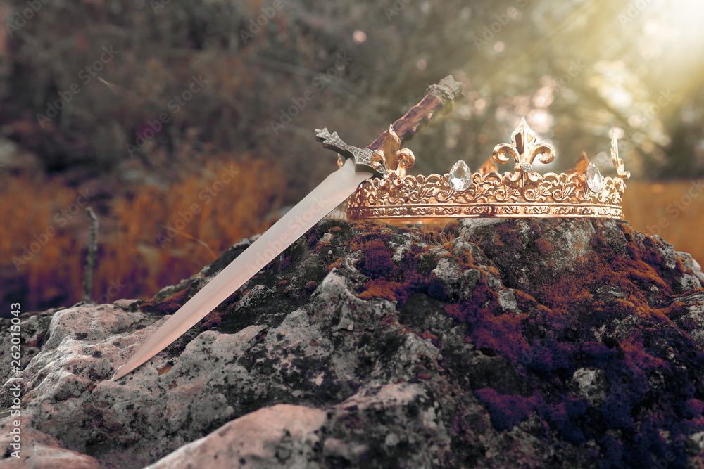 mysterious and magical photo of gold king crown and sword in the ...