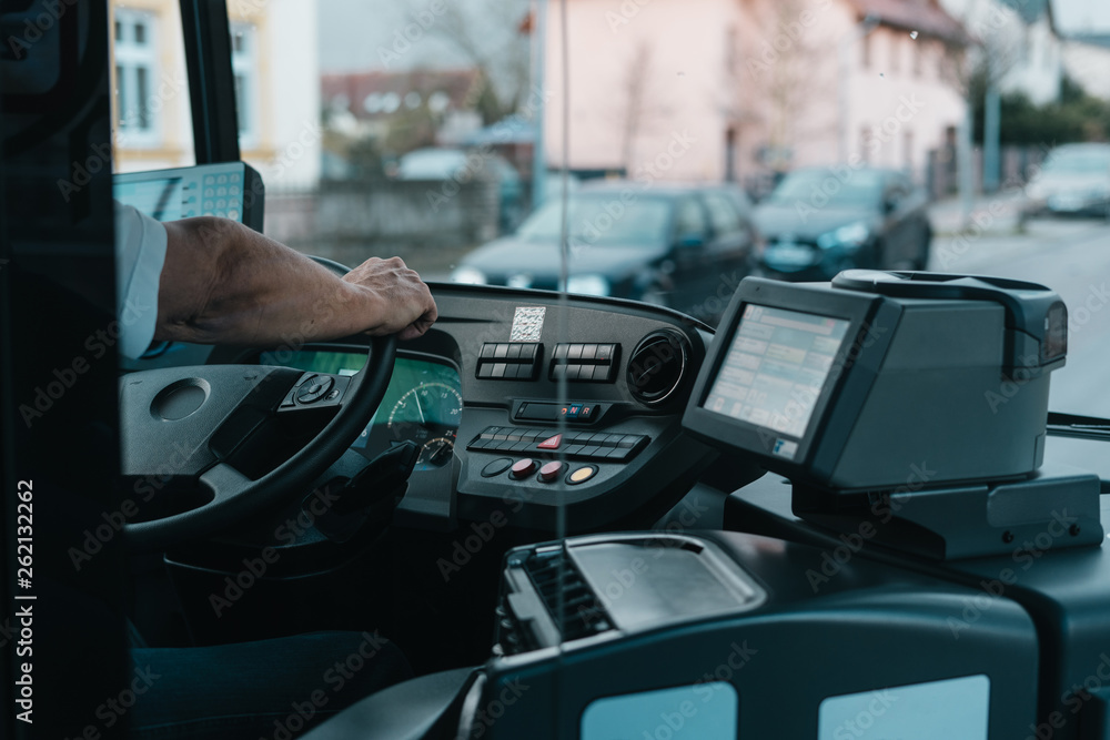 Modern bus interior with drivers hand Stock Photo | Adobe Stock