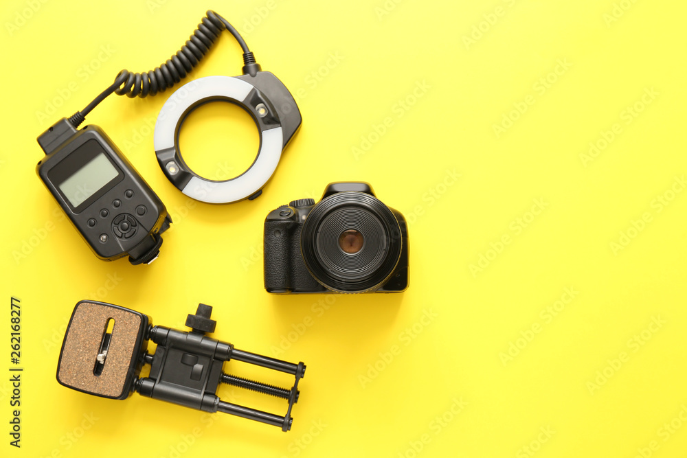 Modern equipment of professional photographer on color background Stock ...