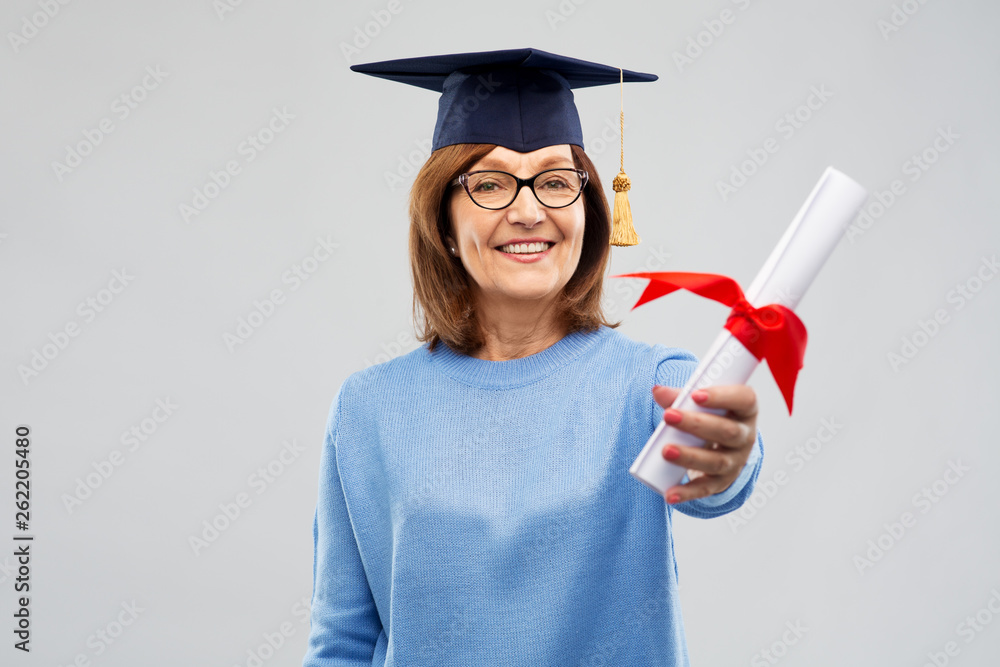 graduation, education and old people concept - happy senior graduate ...