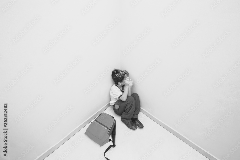 child in school uniform crying and hiding his face. Stock Photo | Adobe ...