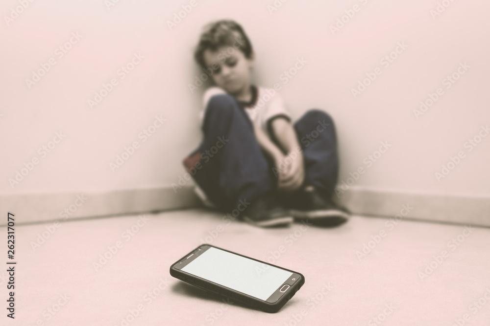 concept of cyber bulling. Child in school uniform crying in front of ...