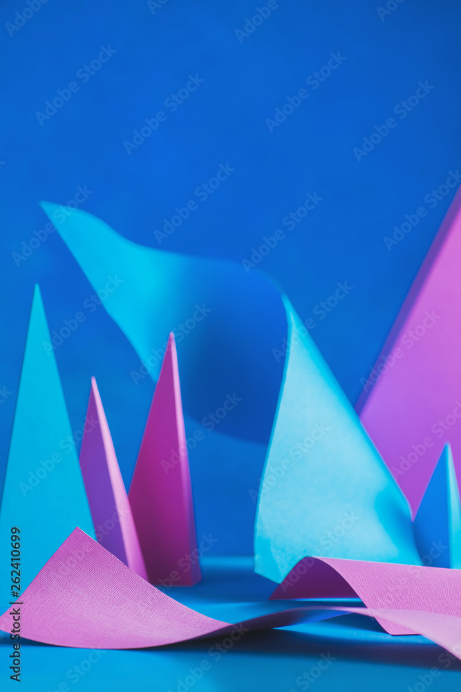 Papercraft shapes, pyramids, and curves in abstract paper sculpture ...