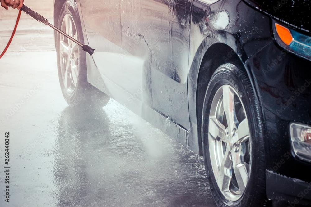 Car washing. Cleaning Car Using High Pressure Water. Stock Photo ...