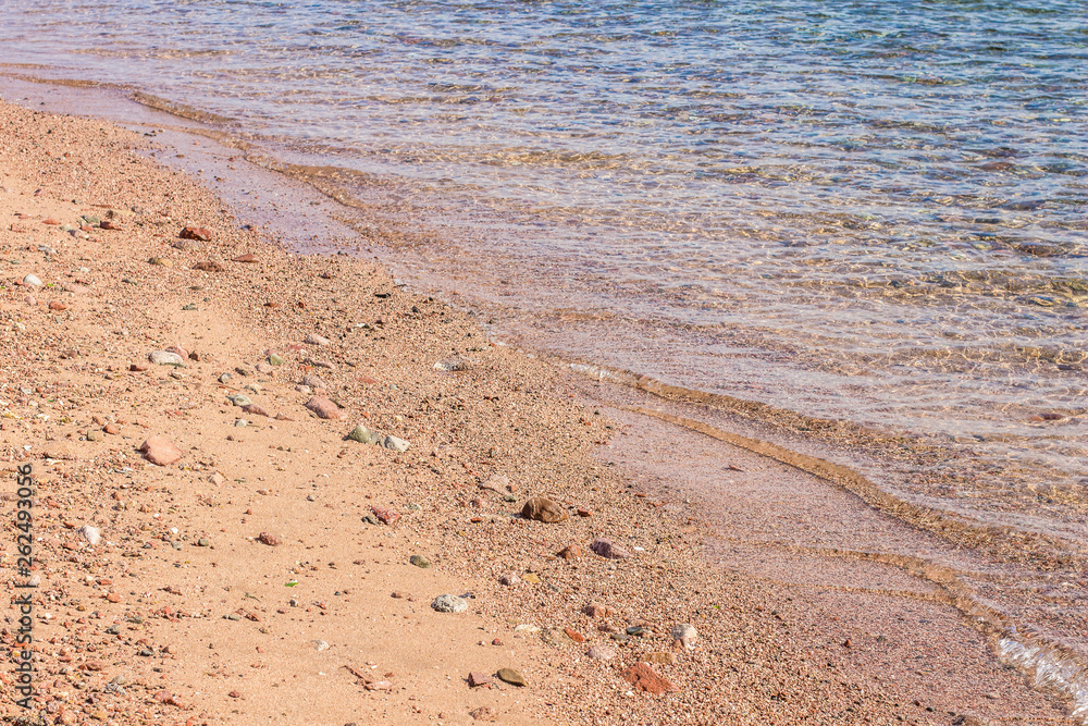 calming scenic landscape of sand and stone beach perspective shoreline ...