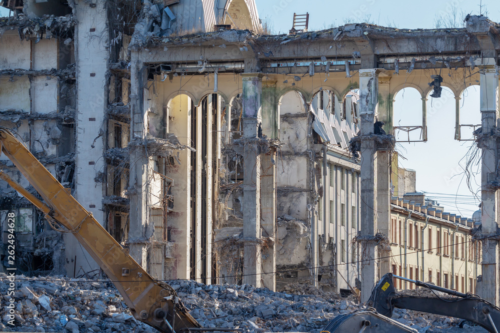 demolition of a building in a modern city. destruction and debris of a ...