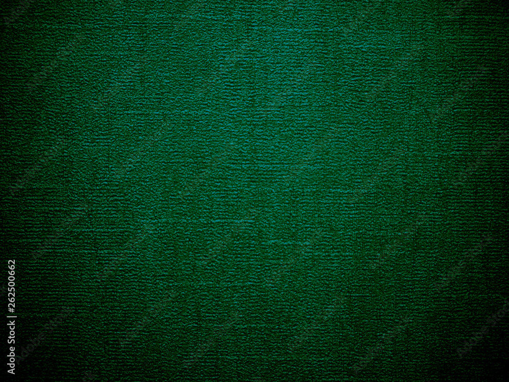 dark green textured background. with dark edges. for lettering and copy ...