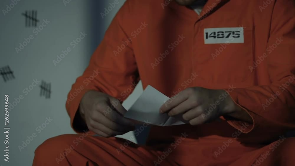 Caucasian prisoner reading letter from beloved, male criminal missing ...