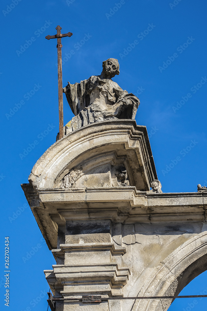 Double parade gate with baroque pediment and figures of saints to Lviv ...