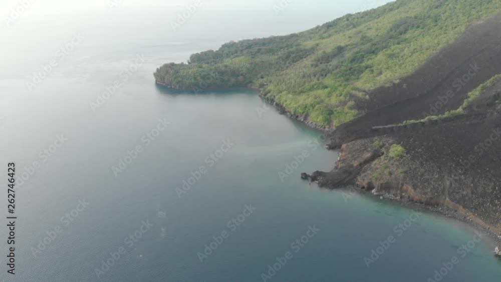 Vidéo Stock Aerial: flying over Banda Islands active volcano Gunung Api ...