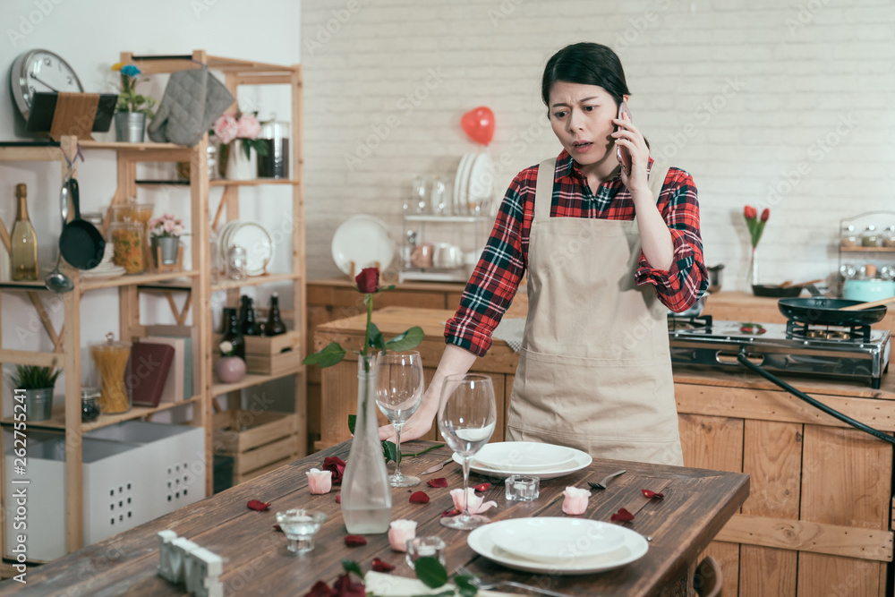Mad woman standing at table and screaming on cellphone. angry young ...