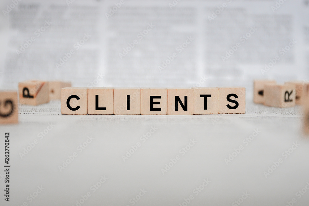 Clients Word Written In Wooden Cube - Newspaper Stock Photo | Adobe Stock