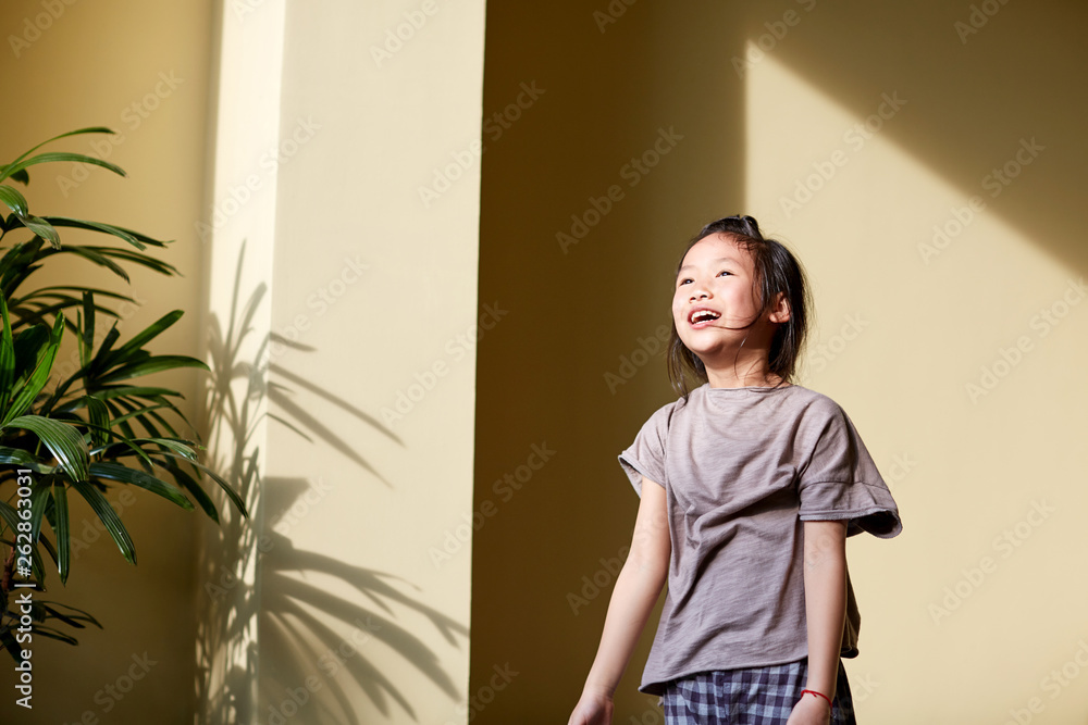 Cute little kid playing with tree shadow on the wall Stock Photo ...