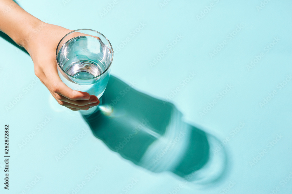 Glass of water with back lighting Stock Photo | Adobe Stock