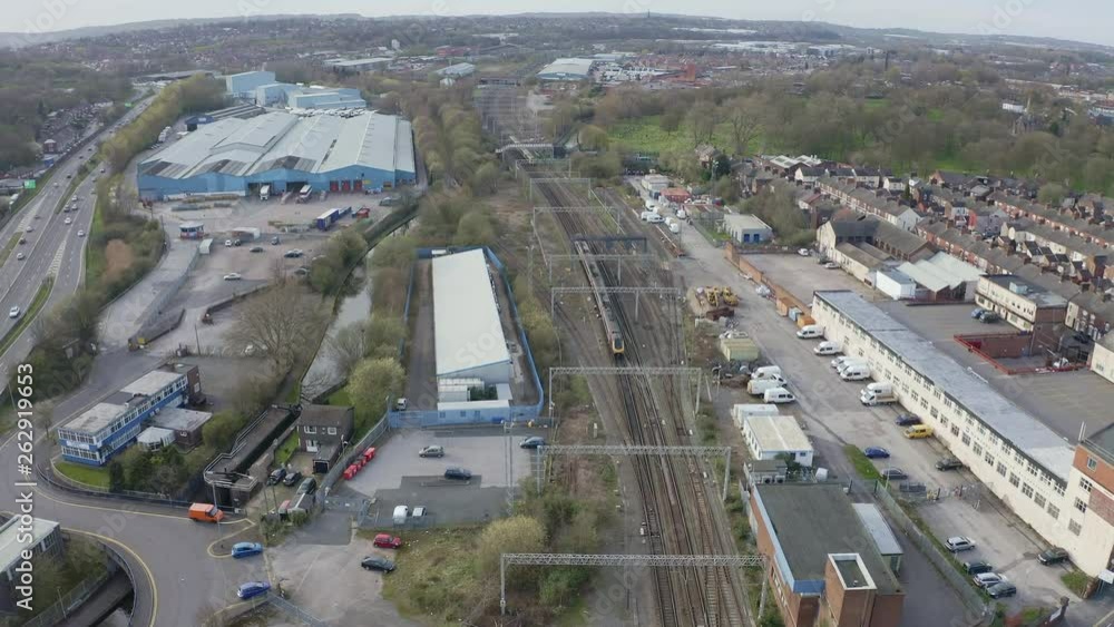 Aerial view, footage of trains passing each by the Stoke on Trent train ...