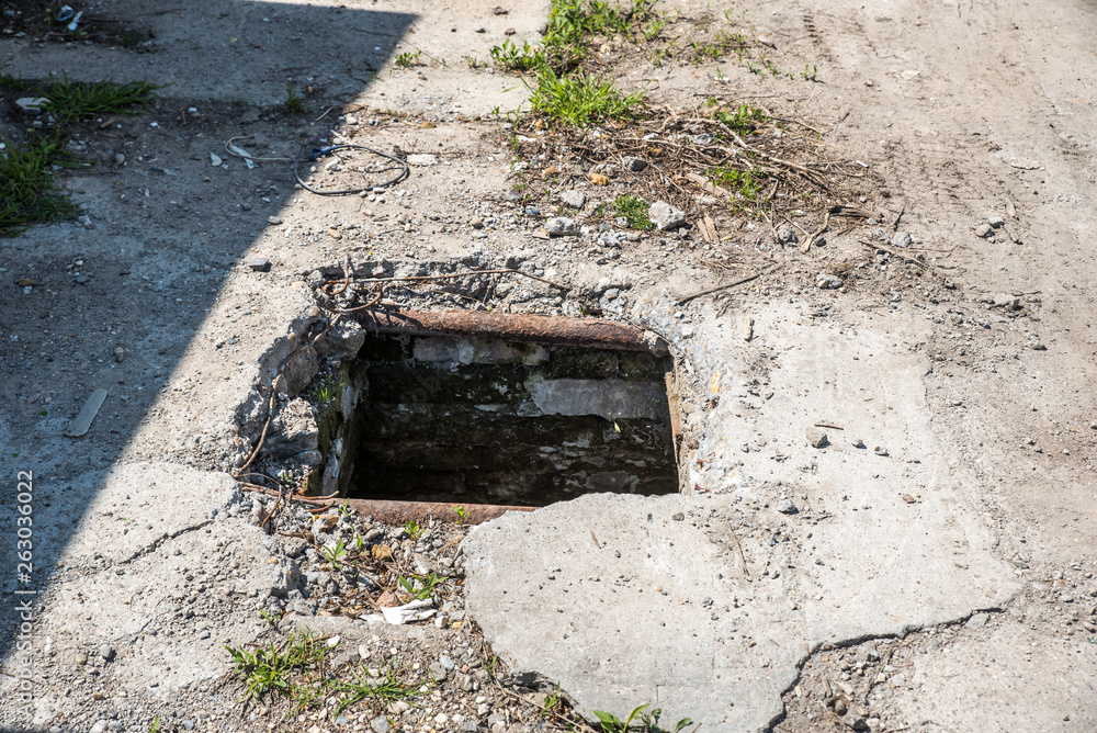 Dangerous opened manhole hole cover, danger for people who walking on ...
