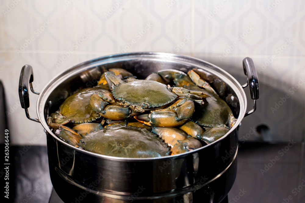 Steamed crab in pot. live crabs in a pot. steaming shanghai hairy crabs ...