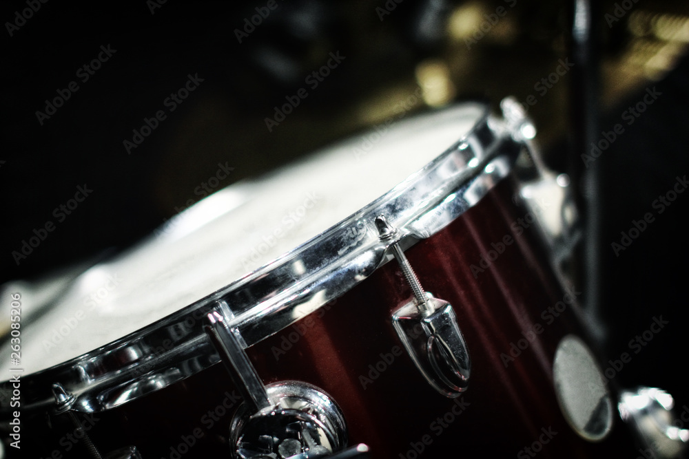 Red drum set on red background. Percussion instruments at a concert ...