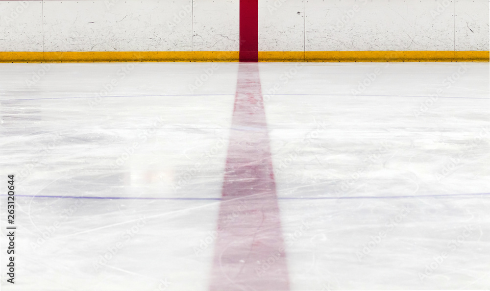 The center red line in a hockey rink. Stock Photo | Adobe Stock