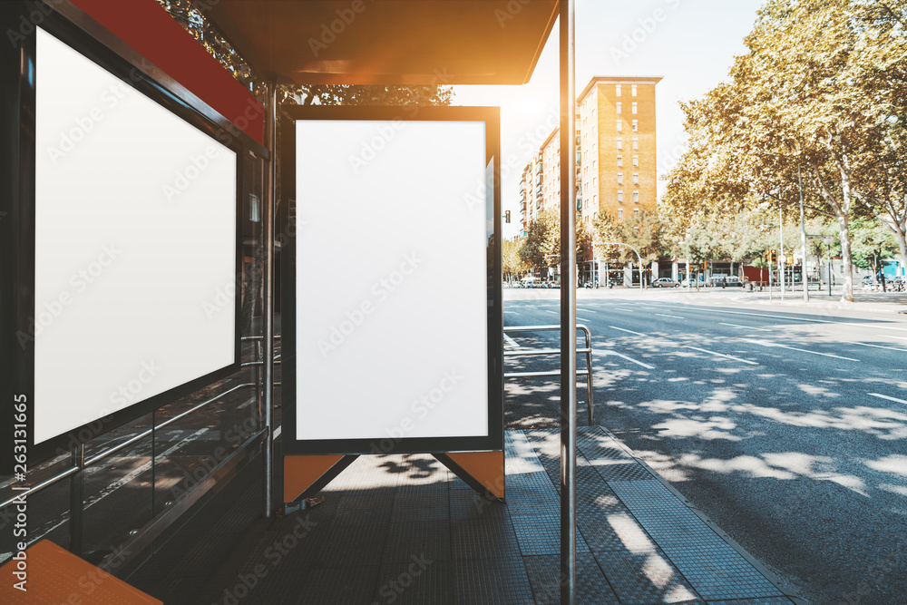 A template of blank ad posters inside of a bus stop; vertical and ...
