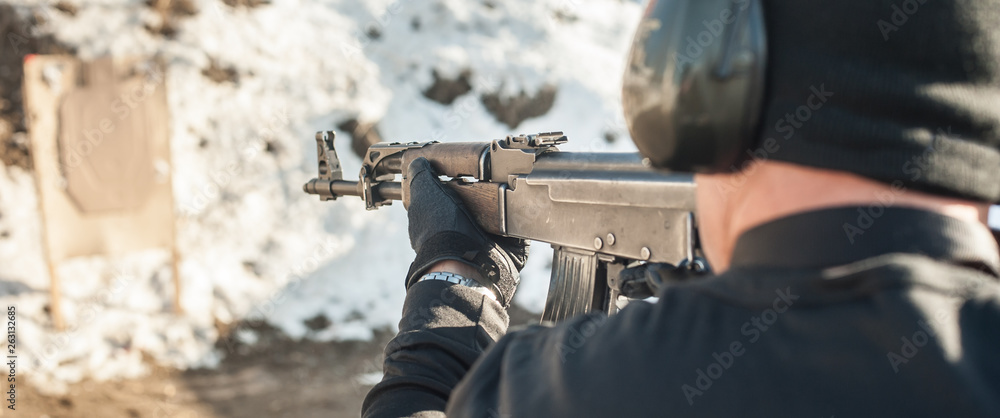 Civilian shooting training from rifle machine gun on shooting range ...